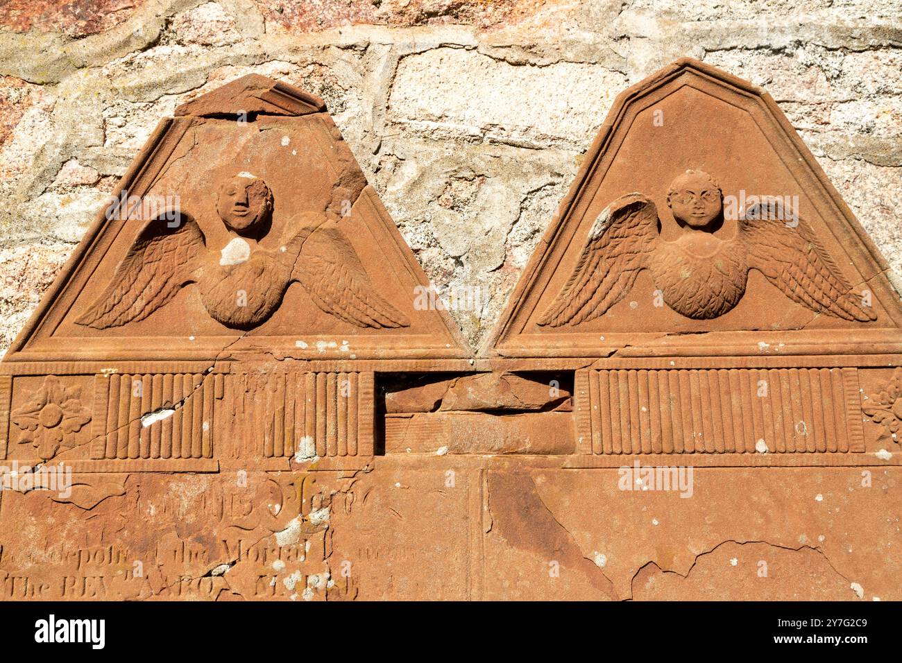 Detail of head with Angel wings carved onto a headstone in St Catherine ...