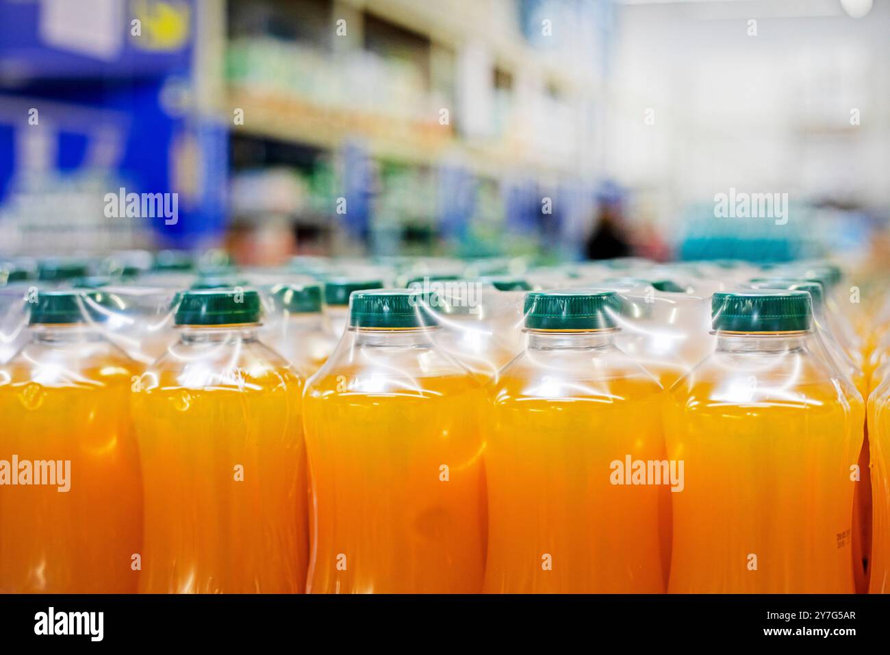 natural juice packed in plastic containers in the supermarket. Healthy ...