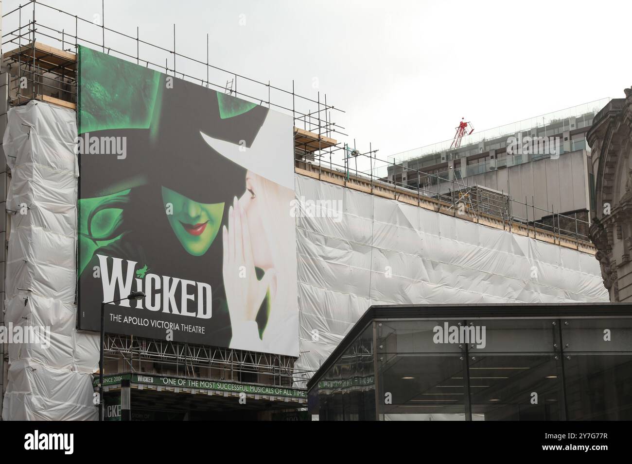 Advertising hoarding poster for Wicked the Musical at Victoria Station ...