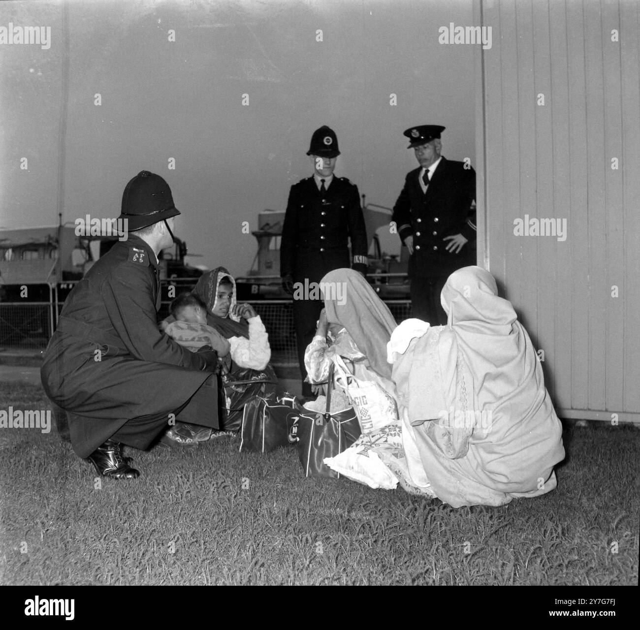 THREE PAKISTANI WOMEN STAGE A SIT AT LONDON AIRPORT ; 14 DECEMBER 1964 ...