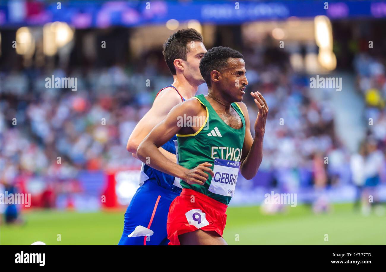 Hagos Gebrhiwet participating in the 5000 meters at the Paris 2024 ...
