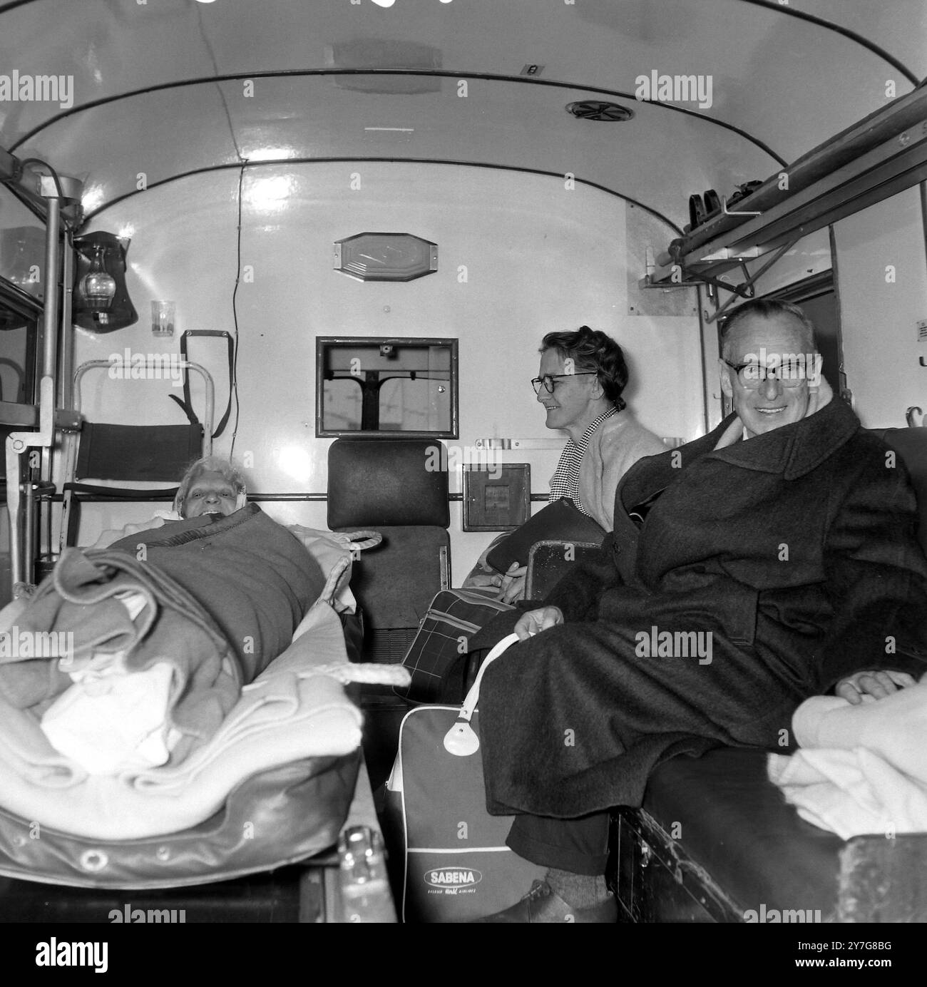 MARY HARRISON WITH JIM GRANGER & WIFE IDA AT LONDON AIRPORT FROM CONGO / ; 10 DECEMBER 1964 ...