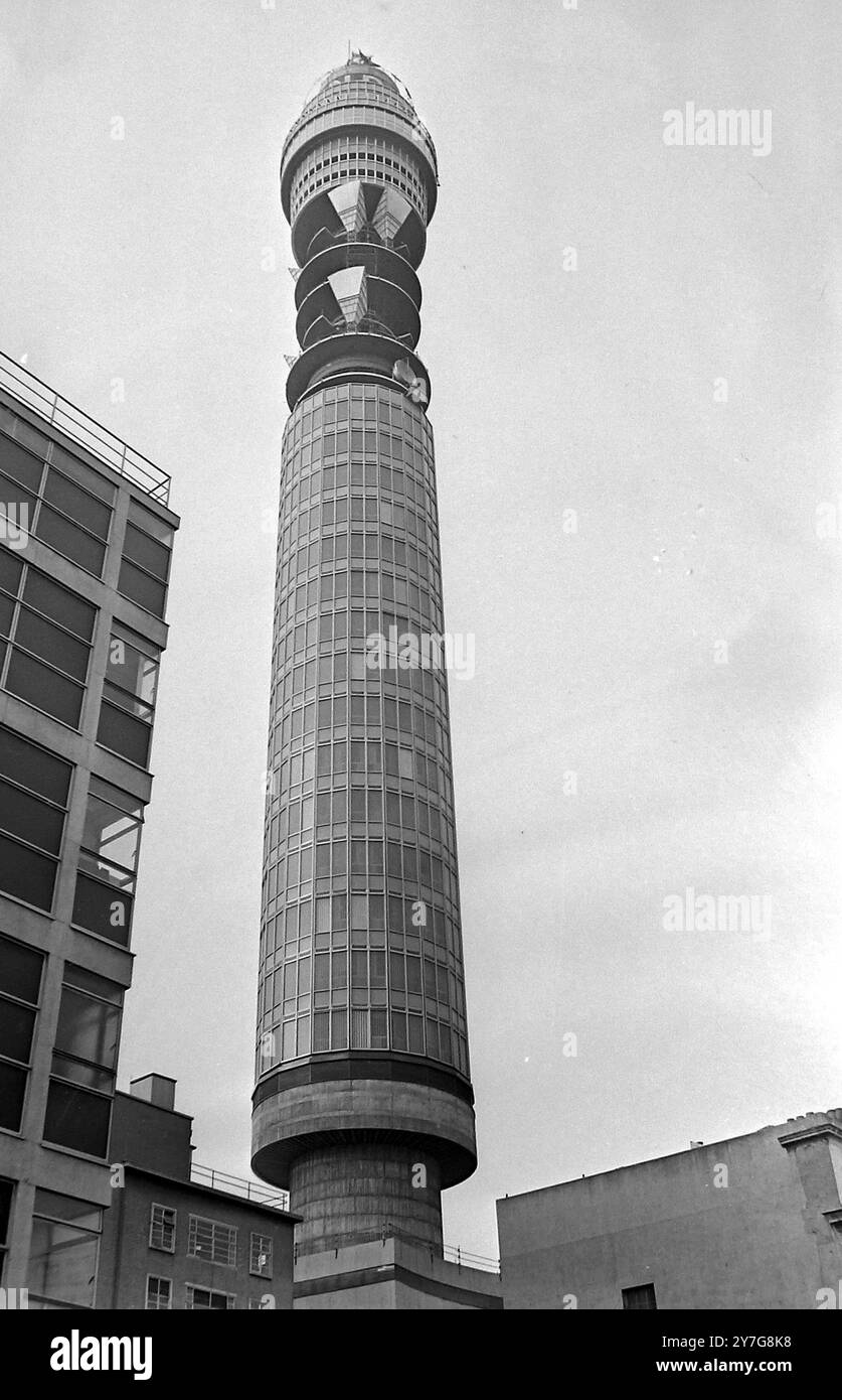 GPO TOWER UPI CORRESPONDENT BOB MUSEL POSES BESIDE TOWER ; 8 DECEMBER ...