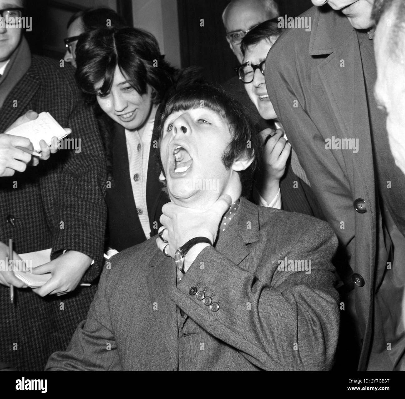1 DECEMBER 1964 Beatles drummer, Ringo Starr, shows newsmen his tonsils ...