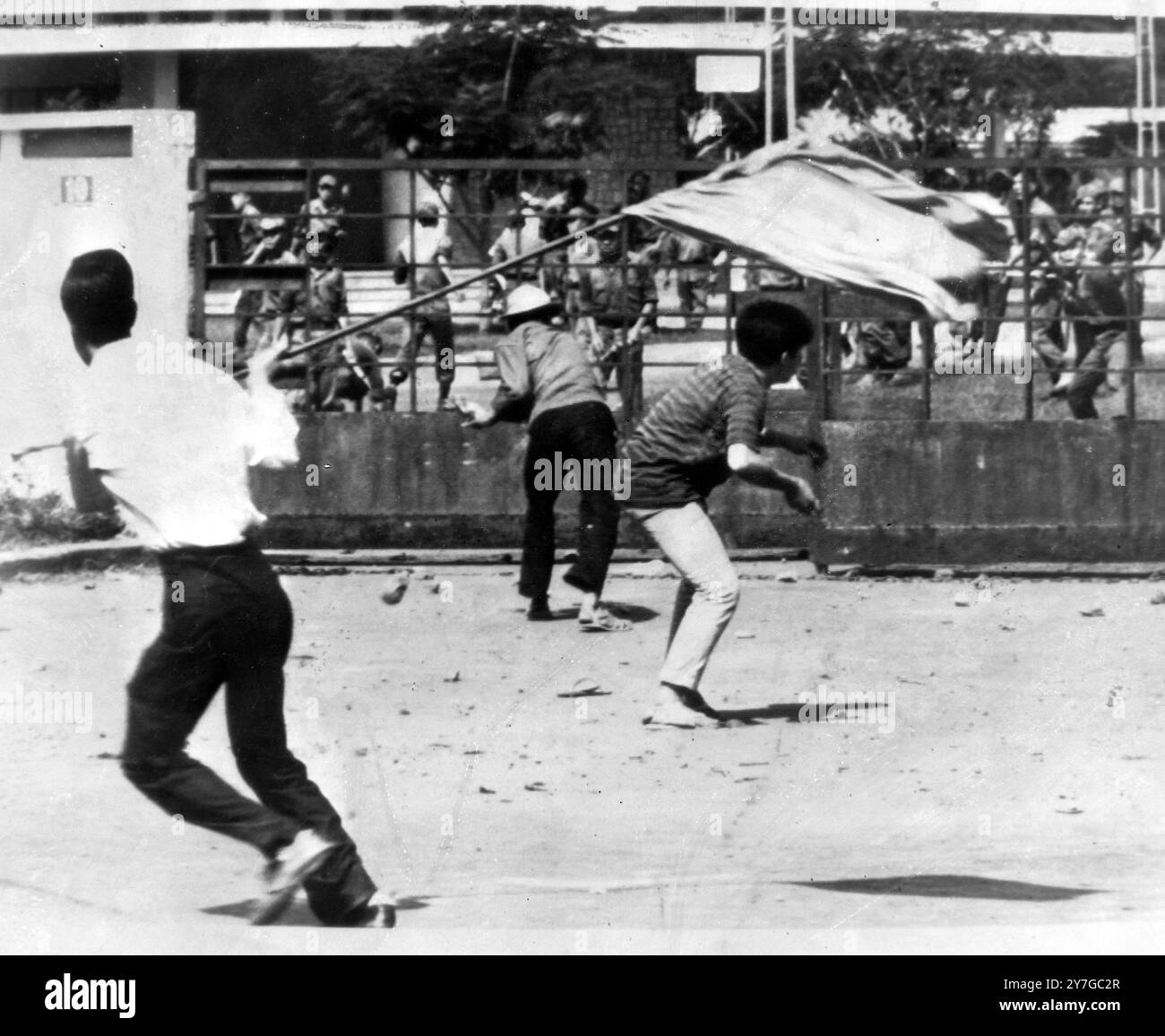 RIOTS STUDENTS THROW STONES AT PARATROOPERS IN SAIGON, SOUTH VIETNAM ...