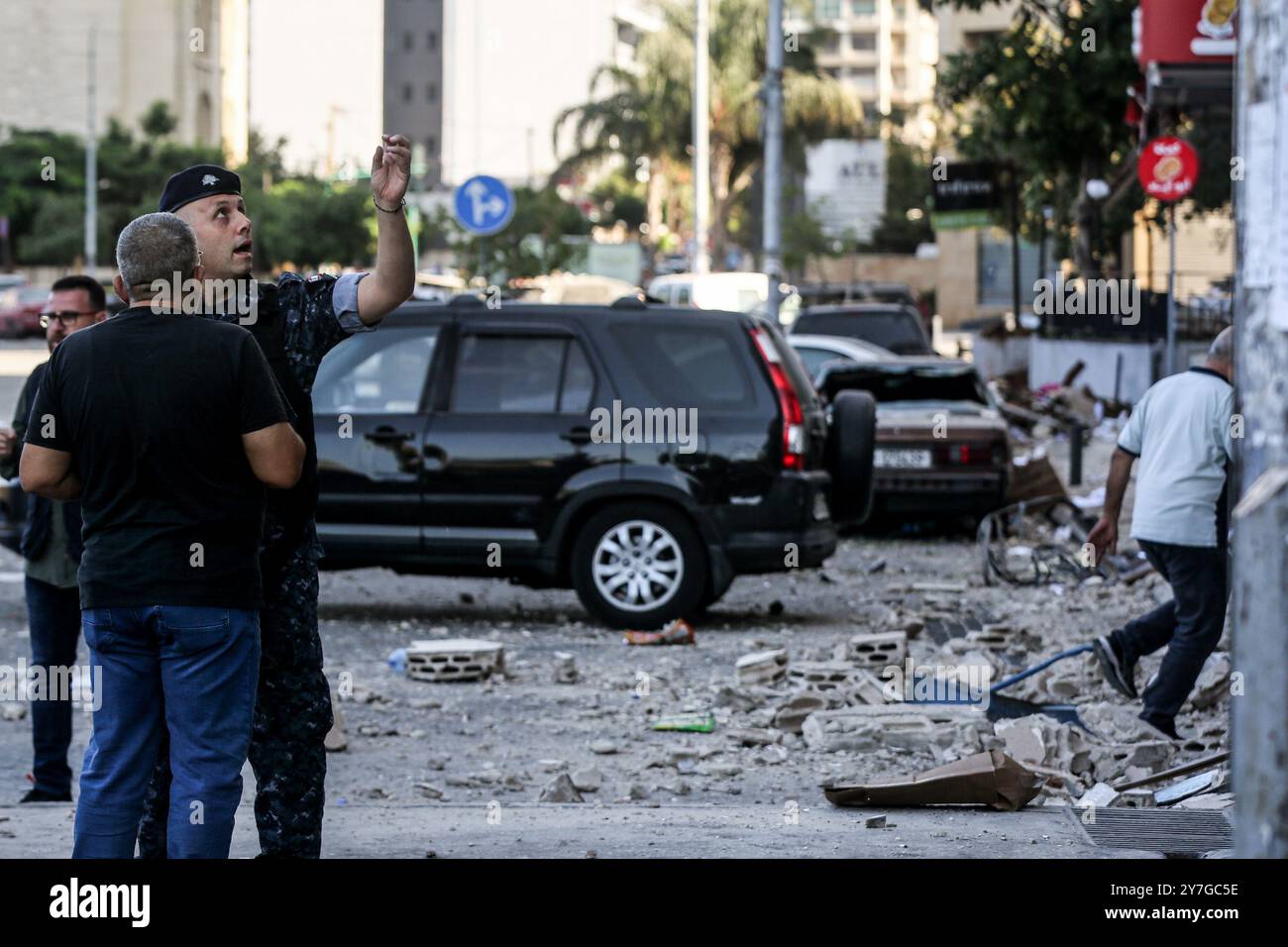 Beirut, Lebanon. 30th Sep, 2024. A Lebanese police officer blocks a ...