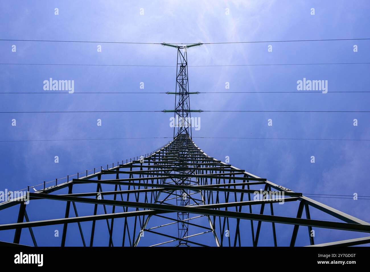 An electricity pylon photographed from the bottom at the foot to the ...