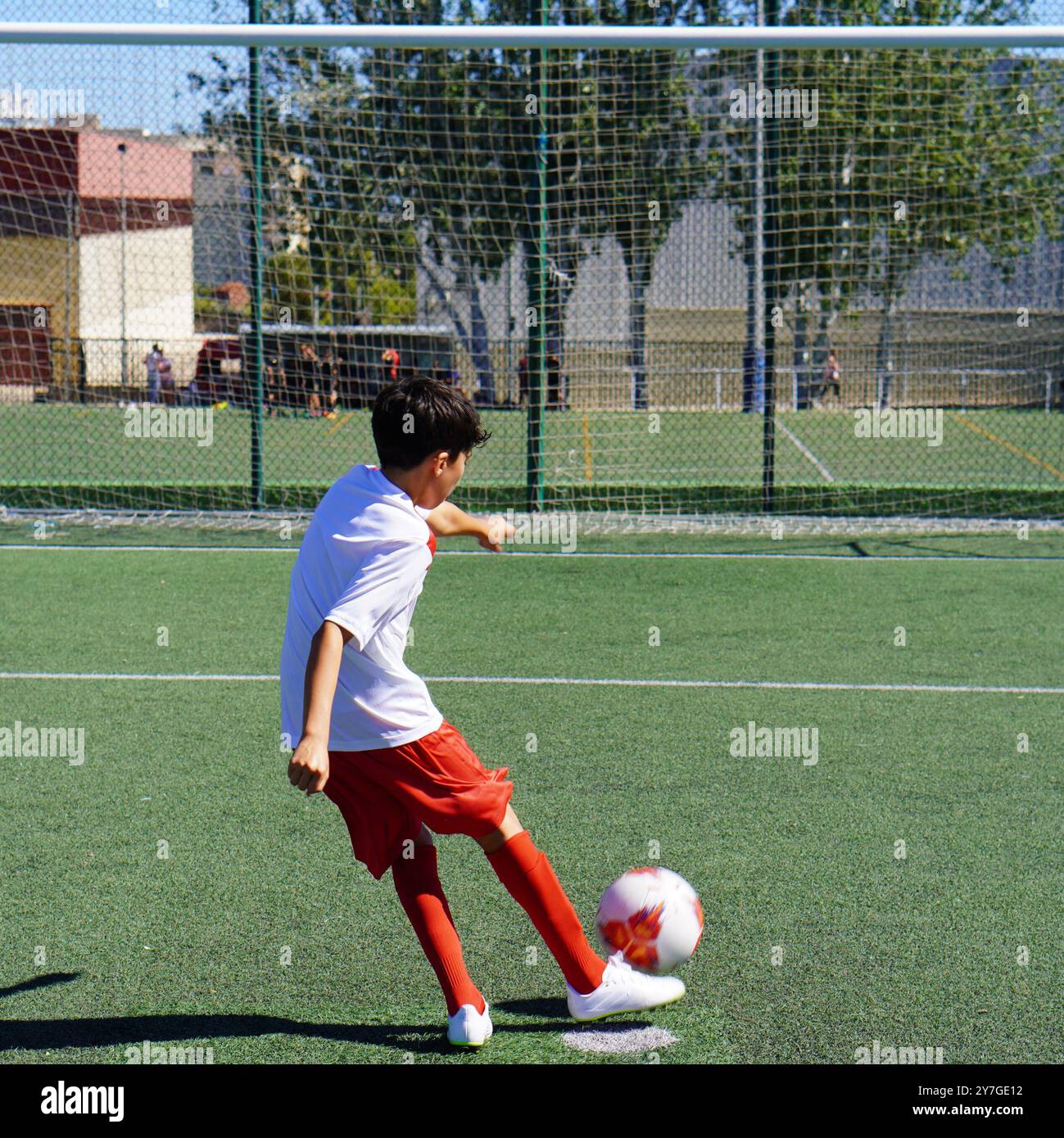 preteen boy shooting at goal from the penalty spot Stock Photo - Alamy