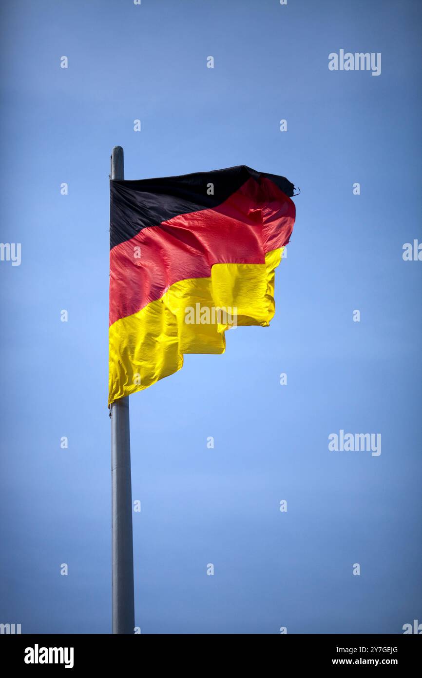 The German flag waves gracefully in the wind, symbolizing patriotism ...