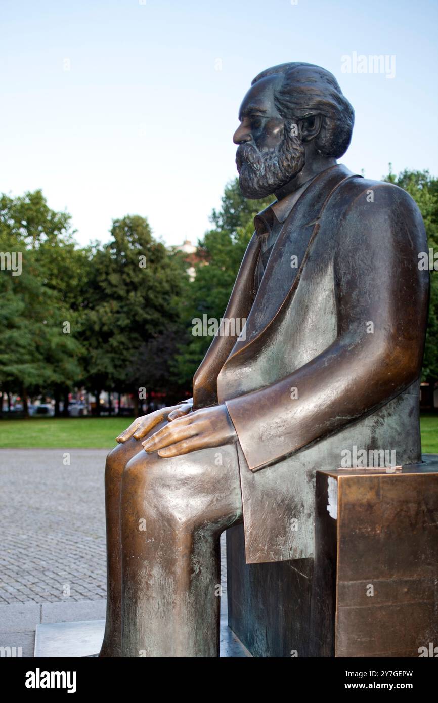 The statue of Karl Marx sits prominently in the Marx-Engels-Forum ...