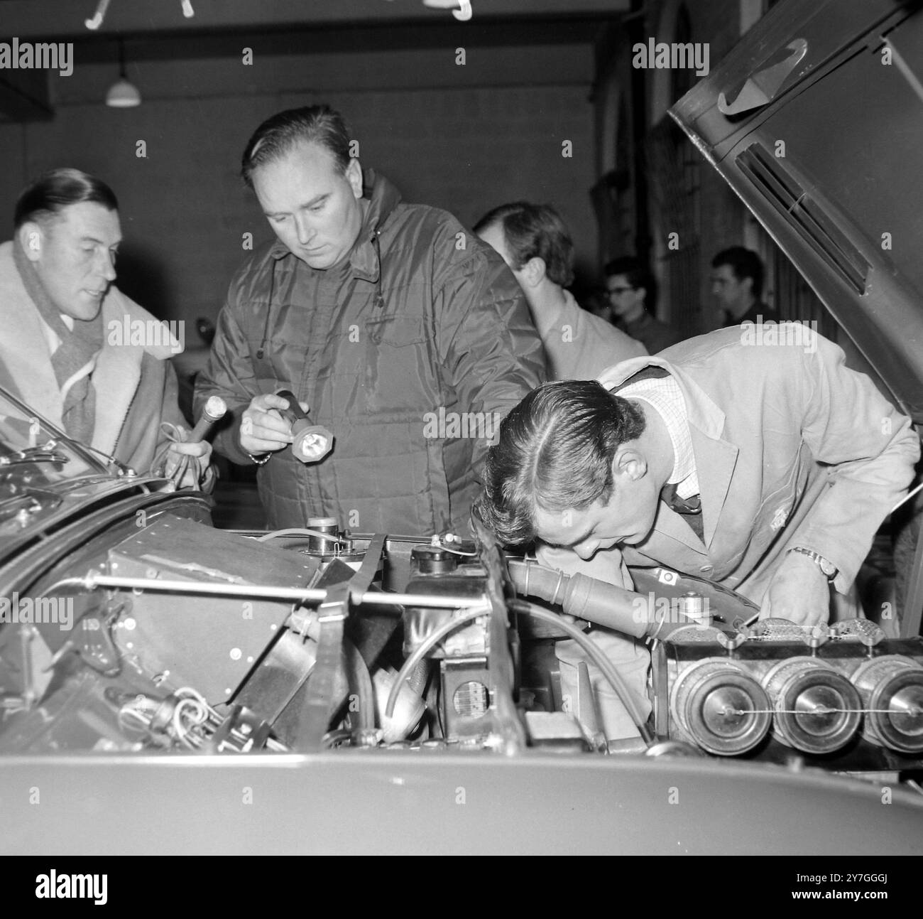 MOTOR RALLY GB INTERNATIONAL ERIC CARLSSON CHECKS ENGINE IN LONDON ; 7 ...