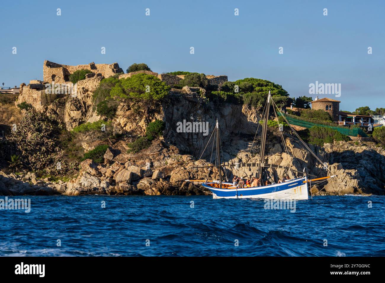 traditional lateen-sailed boat in front of Cala Castell, Costa Brava ...