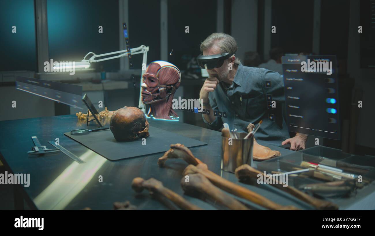 Advanced archaeological lab: Mature archaeologist in VR headset studies ...