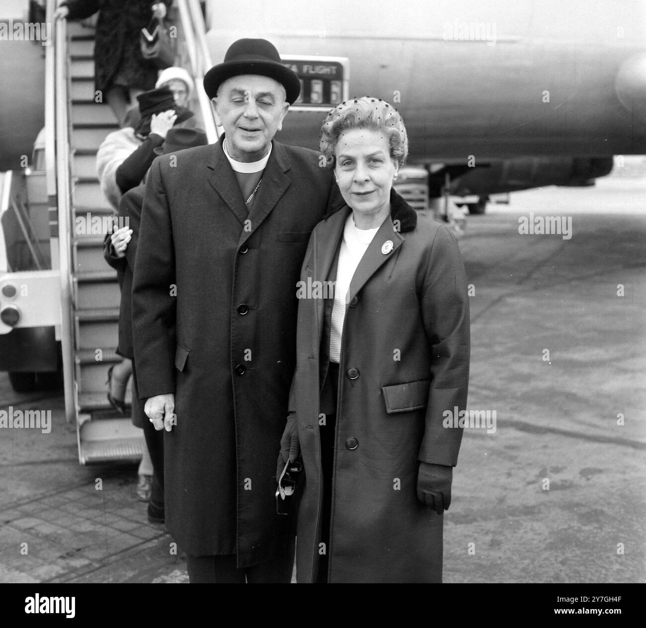 HOWARD CLARK H RUPERTS LAND ARCHBISHOP AND WIFE AT LONDON AIRPORT / ; 5 ...