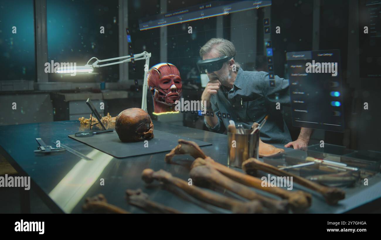 Advanced archaeological lab: Mature archaeologist in VR headset studies ...