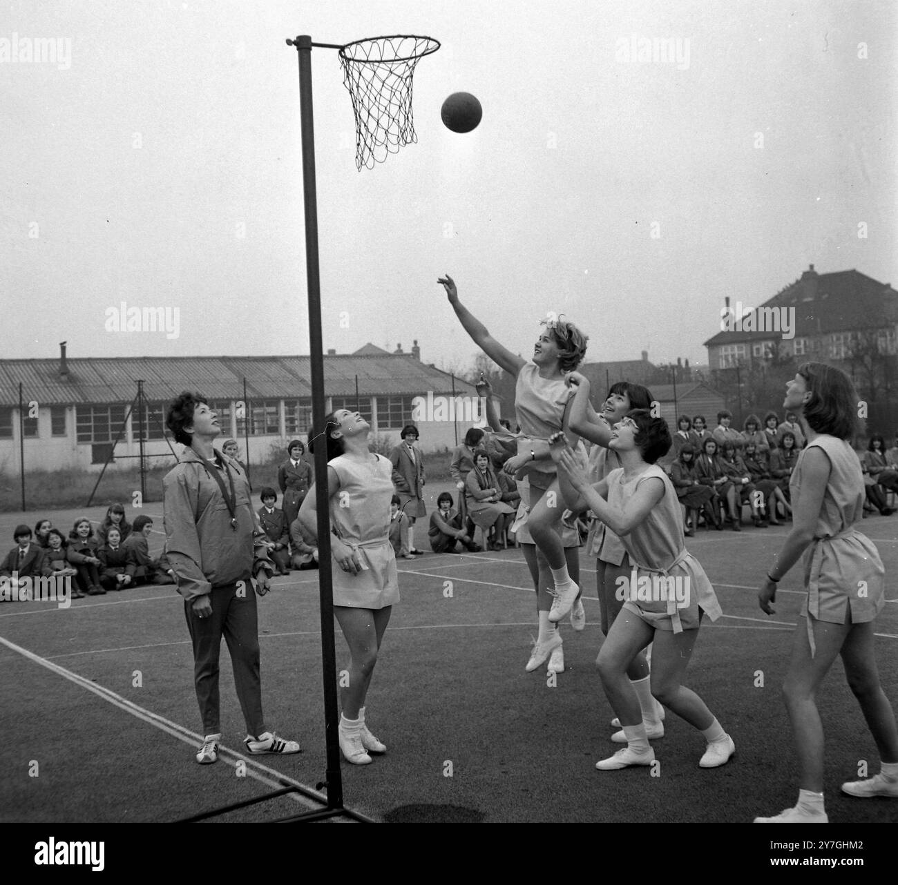 Refereeing a netball match at the Coombe County Secondary School here ...
