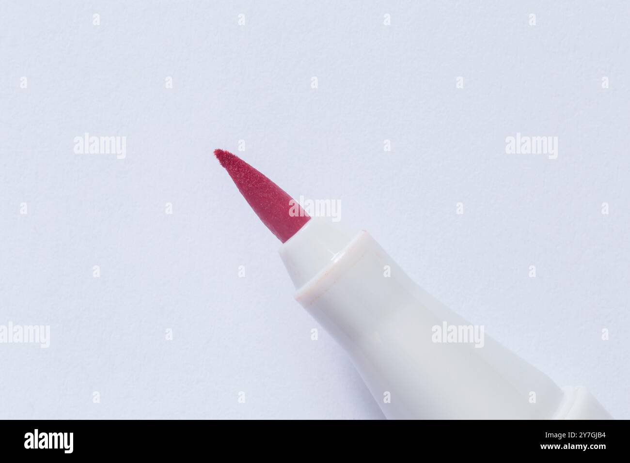 close up of tip of purple marker for sketching at blank white page of ...