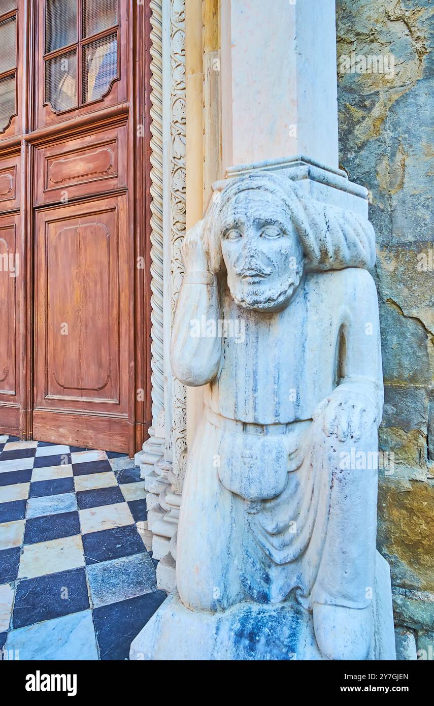 The medieval stone male Telamon, holding the column of Porta dei Leoni ...