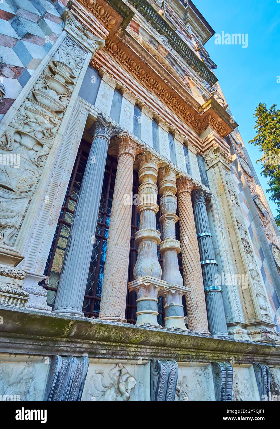 The wall sculptures and ornate carved pillars in the facade of Cappella ...