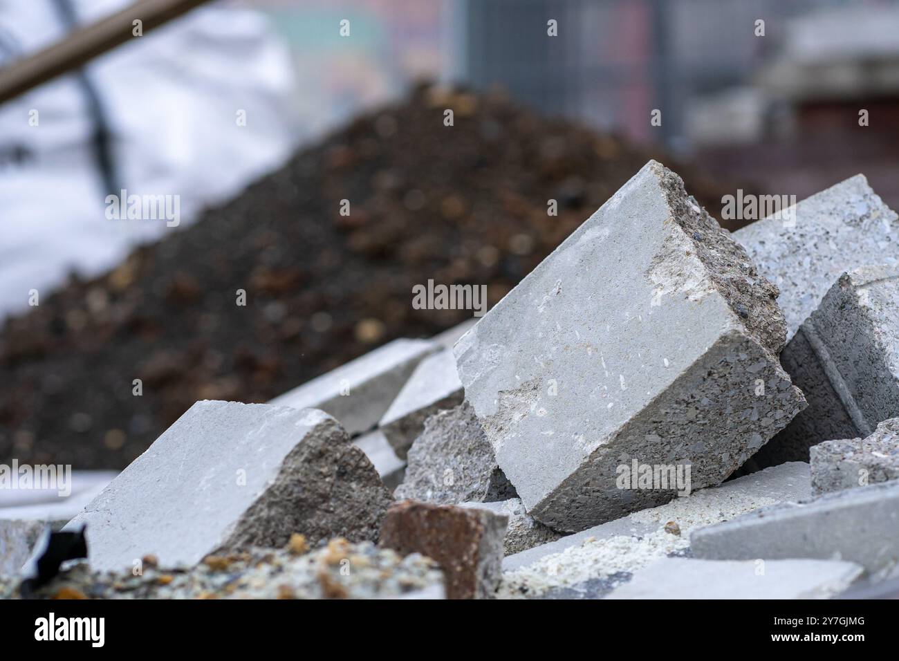 A mountain of rubble and the remains of old paving stones at a ...