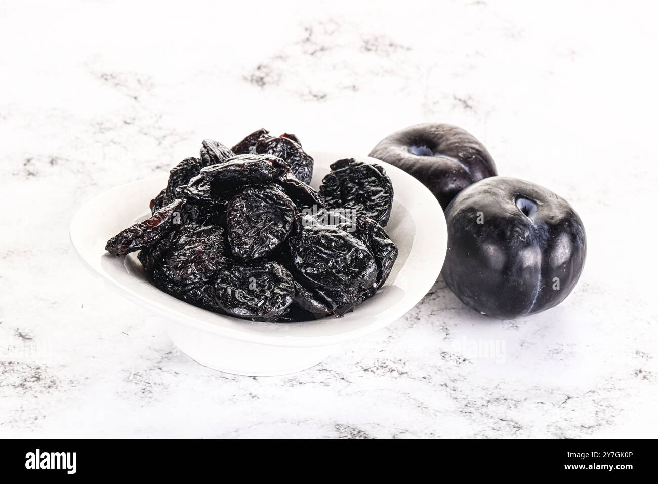 Dry sweet prunes in thw bowl Stock Photo - Alamy