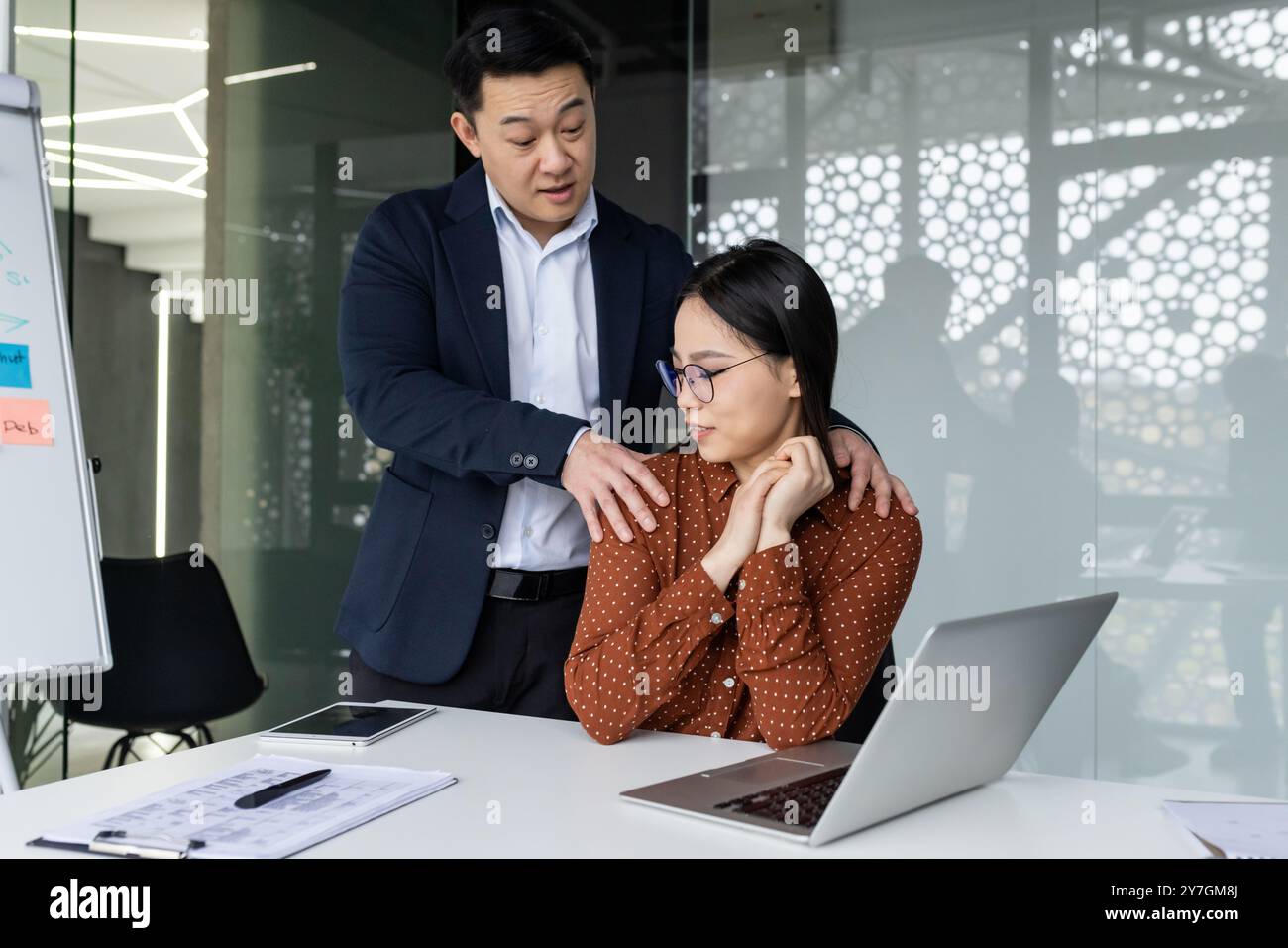 Office scene showing female professional facing unwanted advances from ...