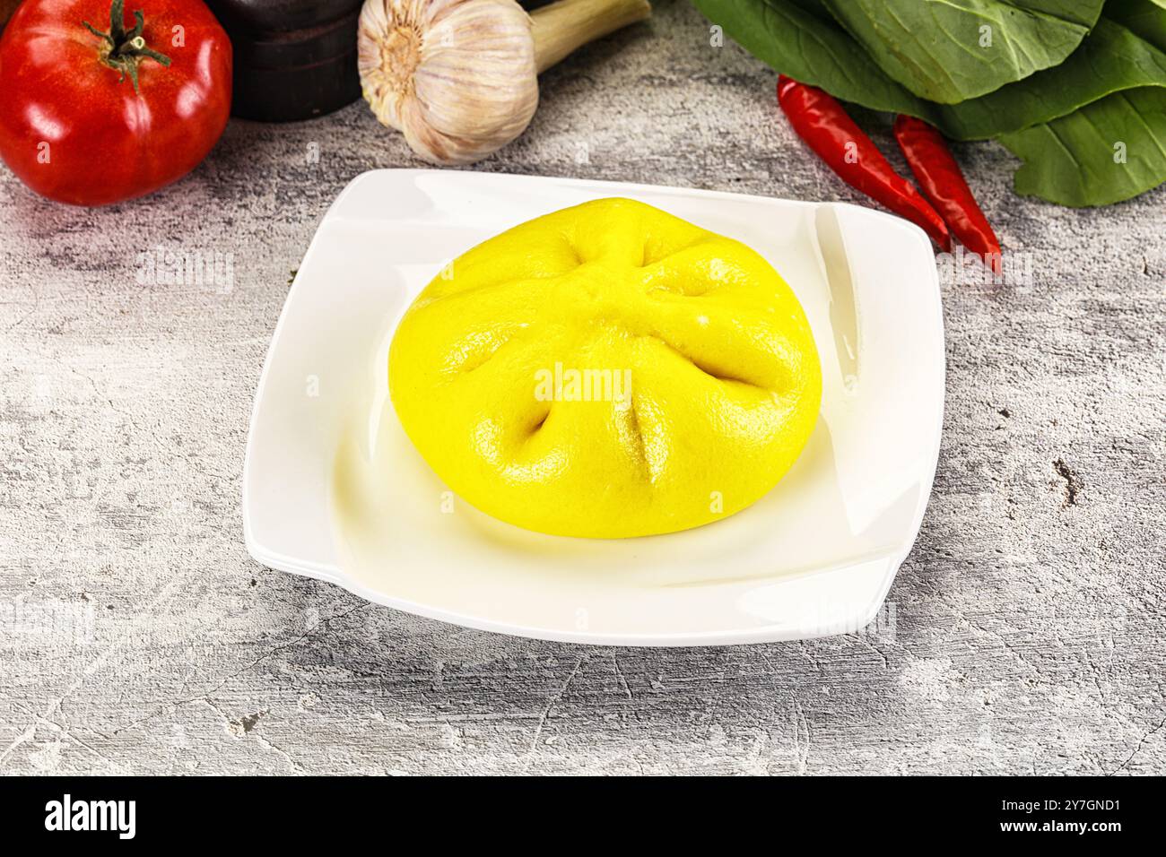 Asian stuffed steamed yellow Bun Bao Stock Photo - Alamy