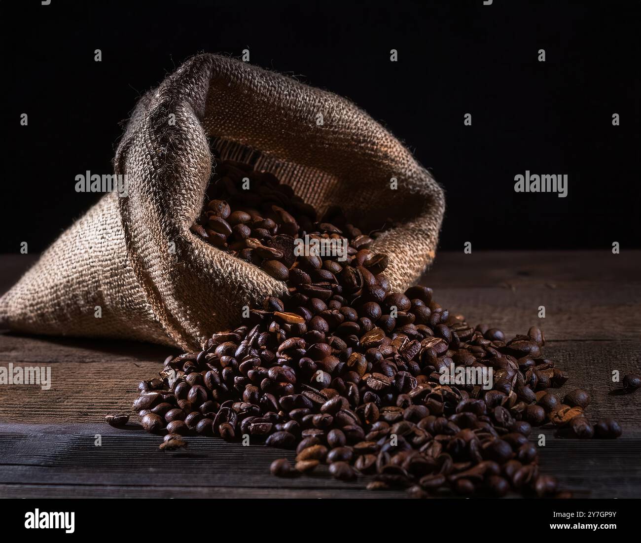 Coffee beans spilling out of a natural linen bag Stock Photo - Alamy