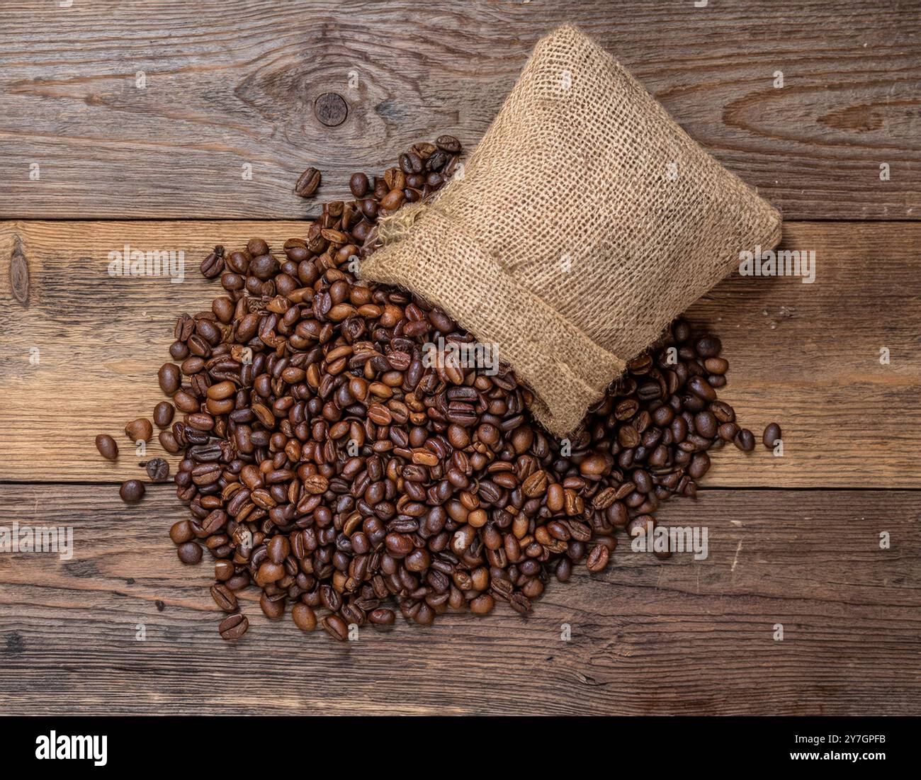 Coffee beans spilling out of a natural linen bag Stock Photo - Alamy
