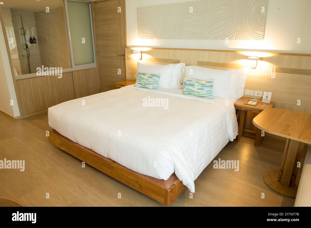 Sleek hotel room design features wood accents and transparent bathroom ...