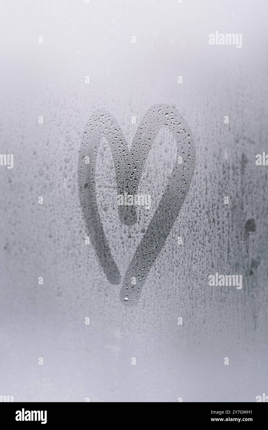 Heart shape drawn on a foggy window Stock Photo - Alamy