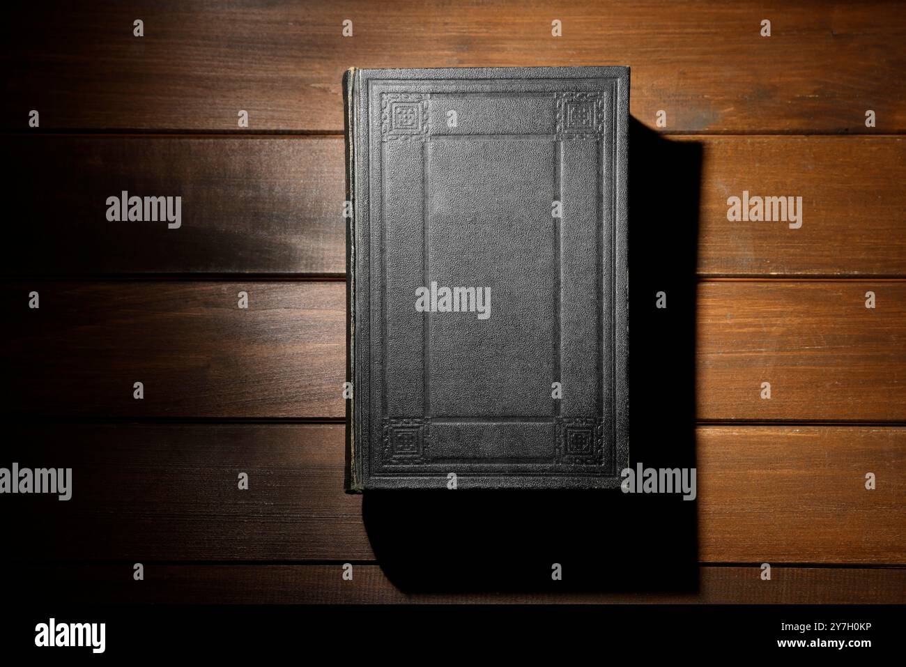 Closed Bible on wooden table, top view Stock Photo - Alamy
