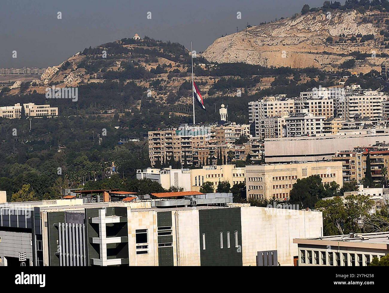 Damascus, Syria. 29th Sep, 2024. A Syrian flag flies at half-mast to ...