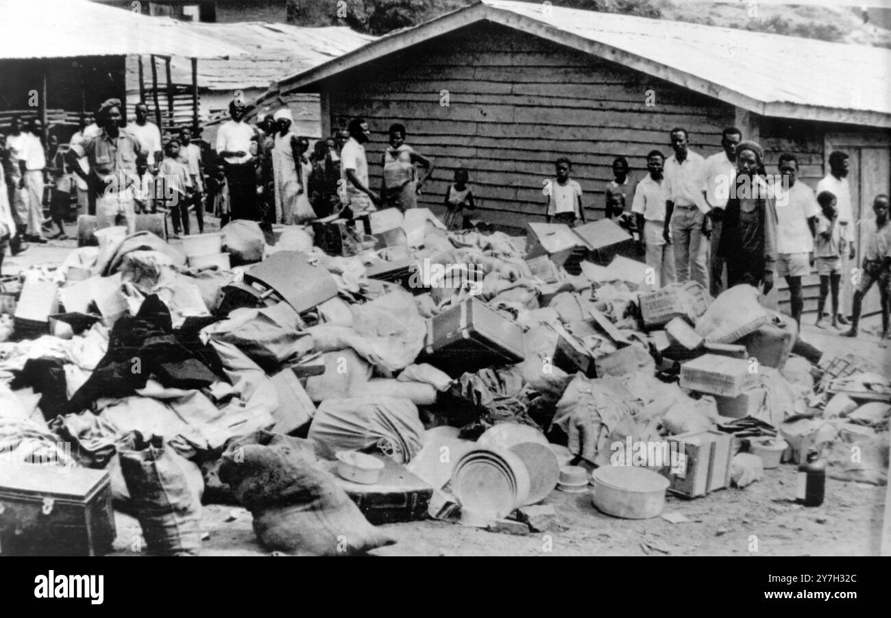 VILLAGERS STAND ROUND PILE OF BELONGINGS IN BUKAVU, CONGO ; 27 AUGUST ...