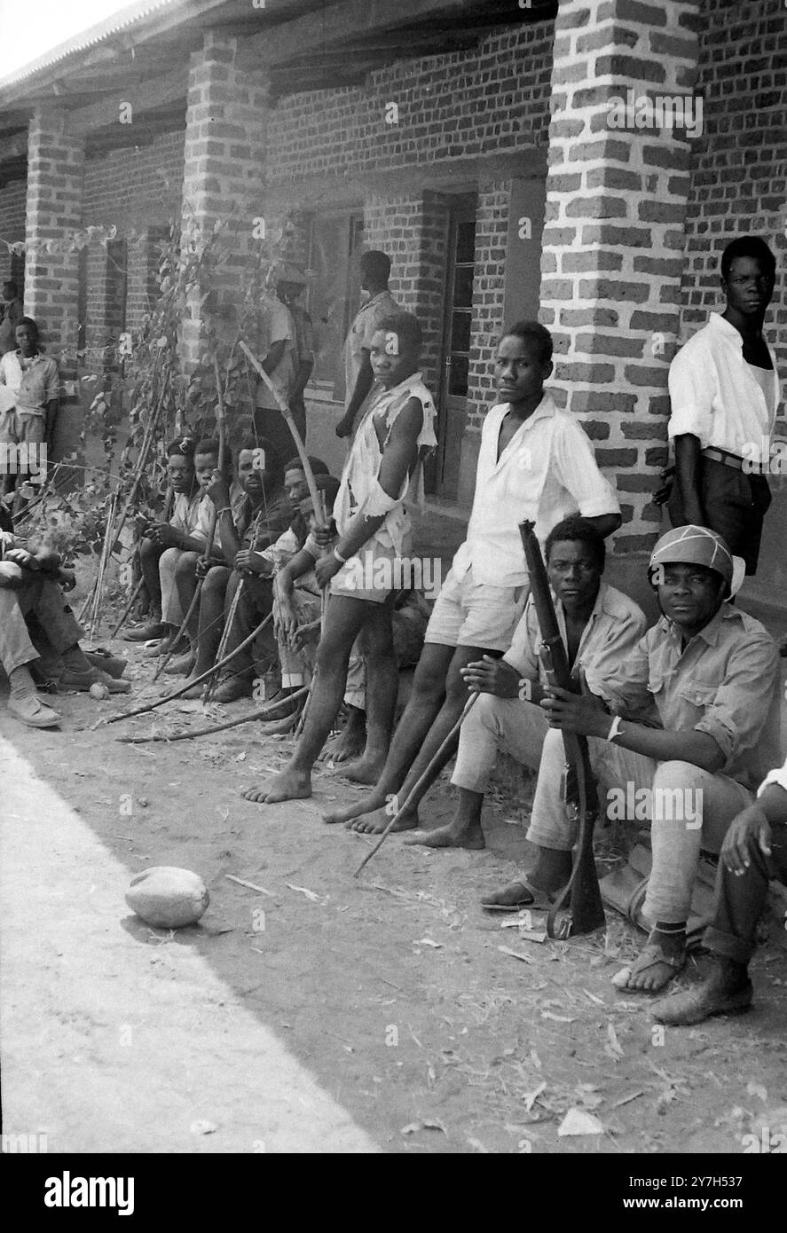 ARMED GENDARME AND BAND OF WARRIORS IN BAUDOUINVILLE, CONGO ; 16 AUGUST ...