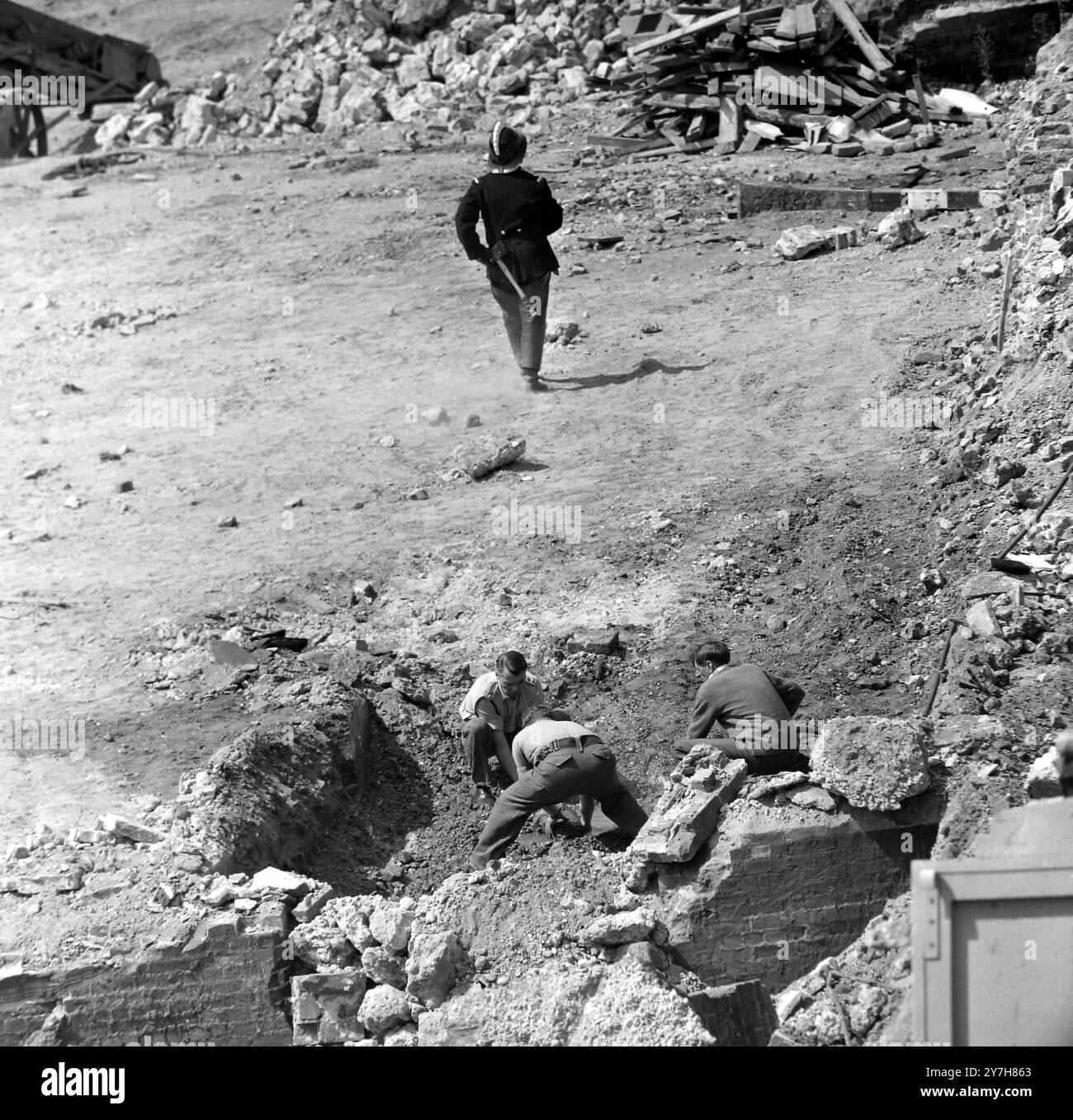 BOMB SITES WORKERS TACKLE UNEXPLODED BOMB IN LONDON ; 28 JULY 1964 ...