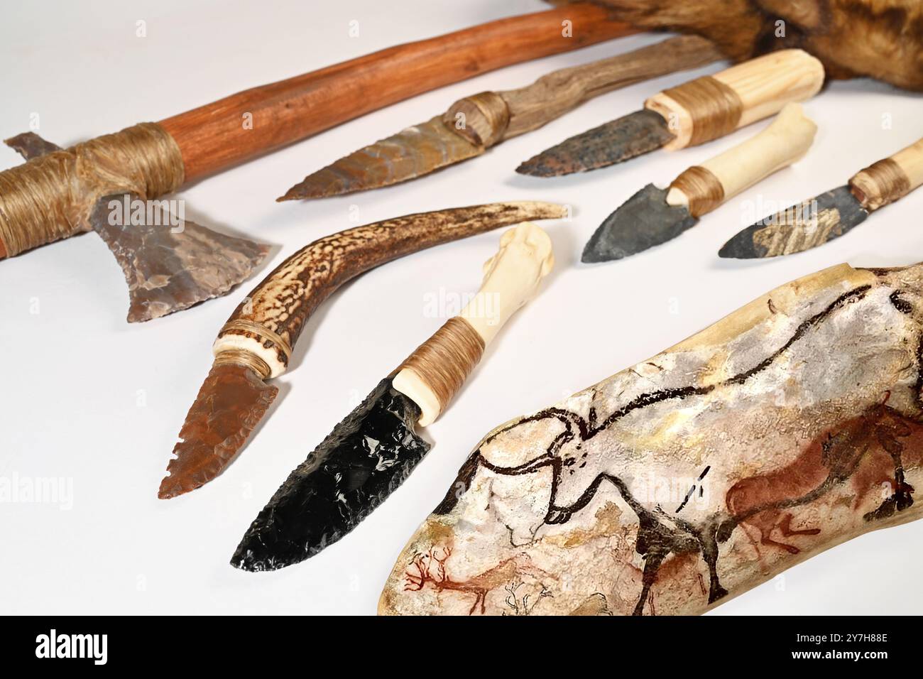 Stone age tools with cave painting artifact replication Stock Photo - Alamy