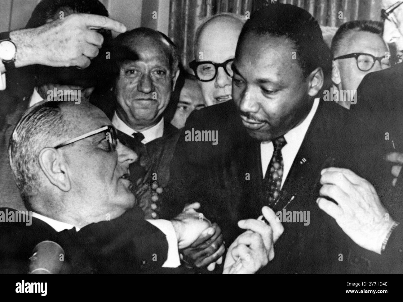 2 JULY 1964 President Lyndon B. Johnson shakes hands with the Rev ...