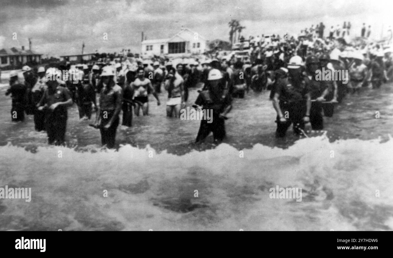 RACIAL SEGREGATION POLICEMAN WIELDING CLUBS ON BEACH IN ST AUGUSTINE ...