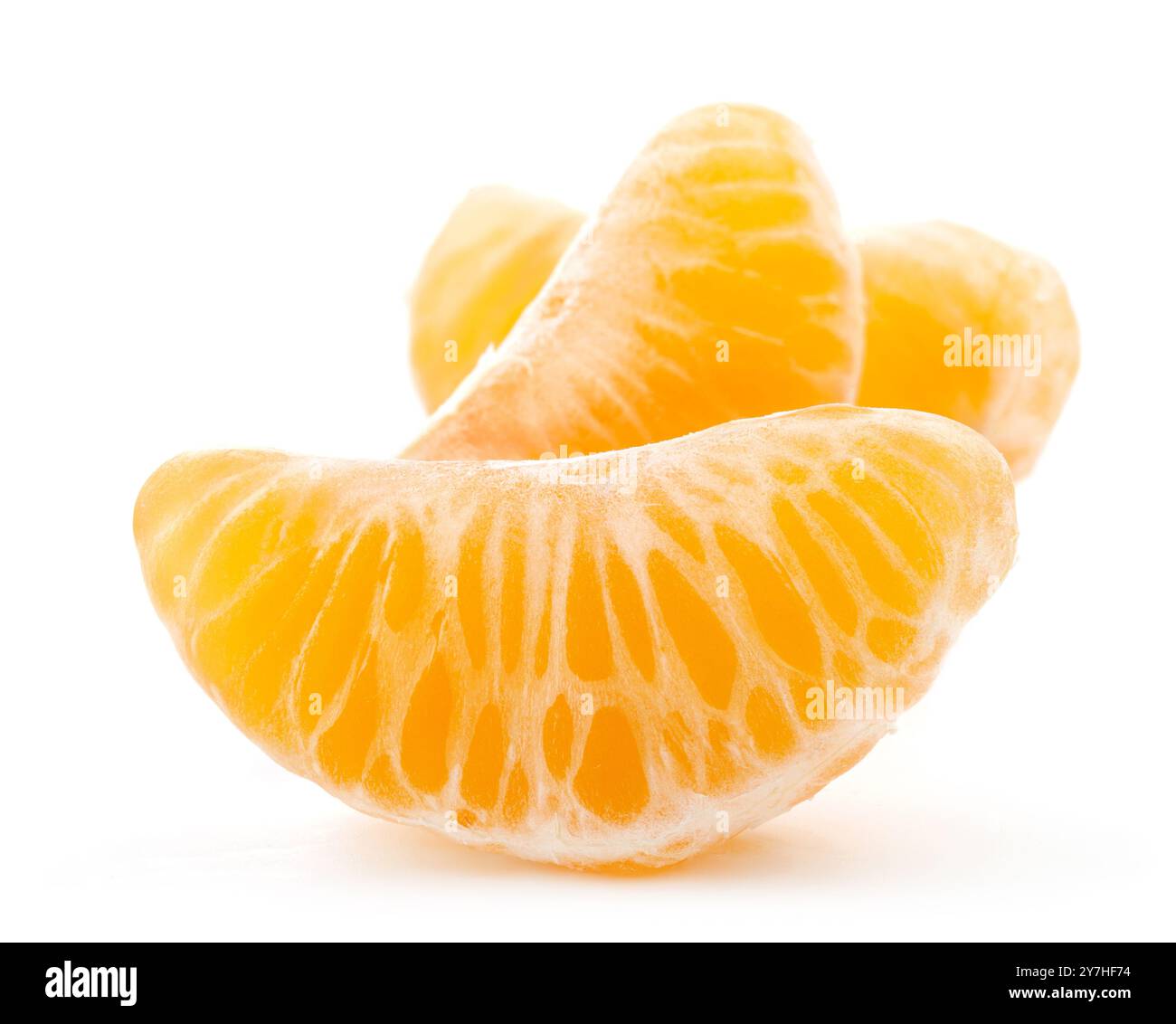 Peeled pieces or slices of mandarin, tangerine or clementine isolated ...