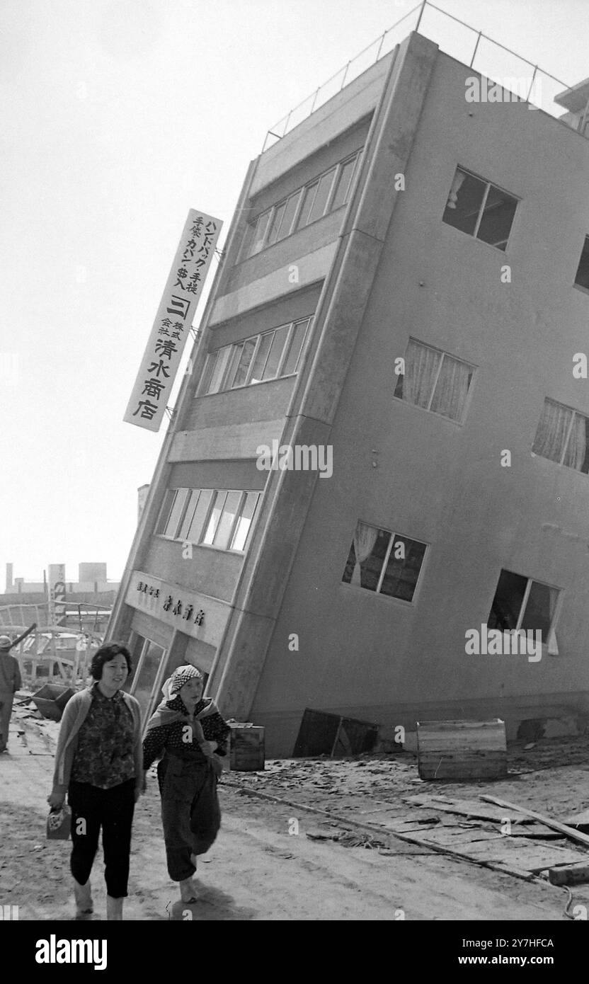 EARTHQUAKE NIIGATA BUILDING TILTS ON FOUNDATIONS IN JAPAN ; 19 JUNE ...