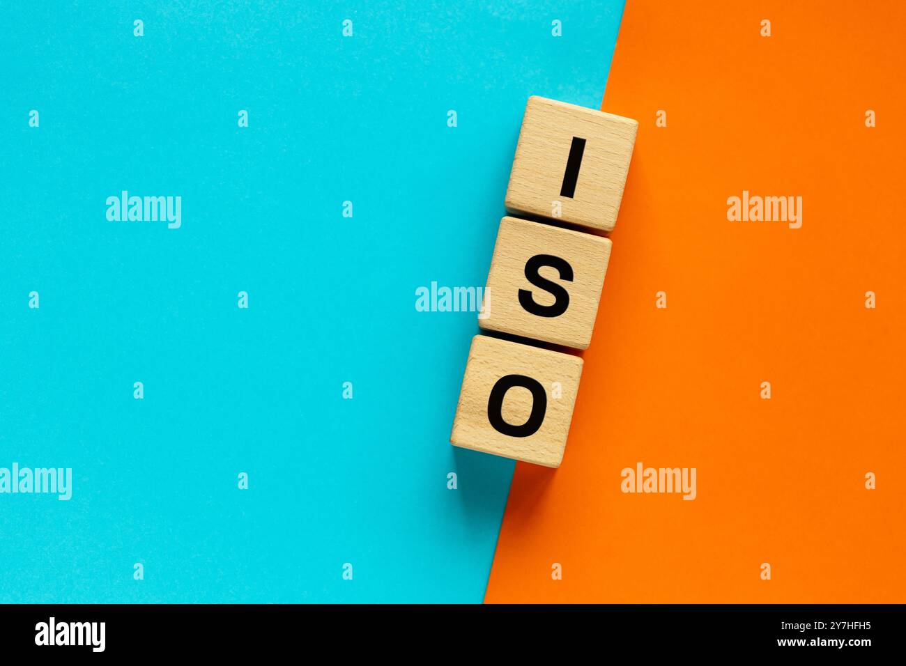 ISO 9001 certified concept. Text ISO on the wooden cubes. orange and ...