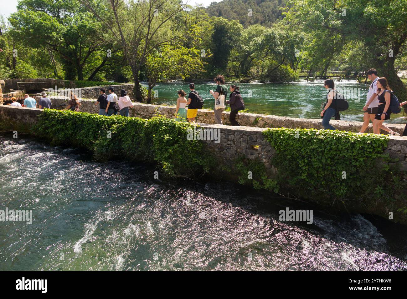 Beautiful scene view with low level stone bridge river crossing used by ...