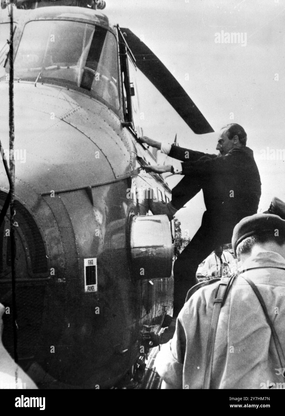 HUGH FRASER AT SARAWAK OPERATIONS ENTERING HELICOPTER IN KUCHING / ; 25 ...