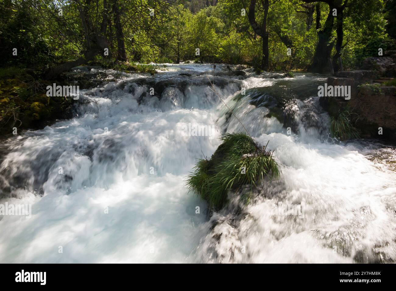 Kirka river flows fast and furious over rocks creating white water ...