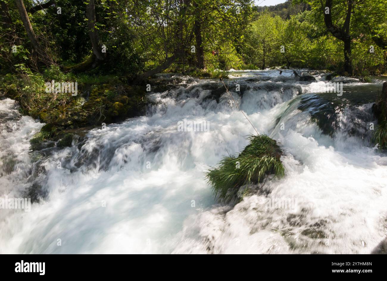 Kirka river flows fast and furious over rocks creating white water ...