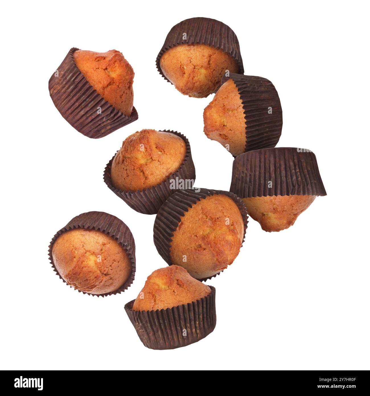 Delicious muffins in air on white background Stock Photo - Alamy