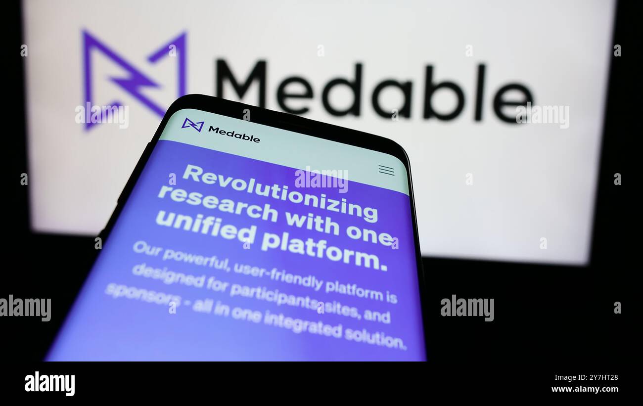 In this photo illustration, a smartphone with the website of US ...