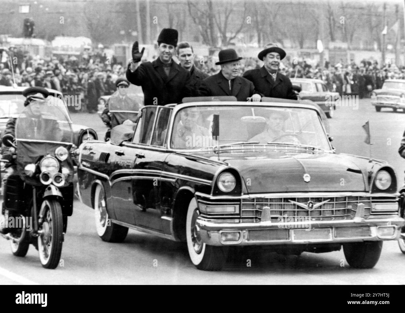 25 APRIL 1964 ALGERIAN PREMIER AHMED BEN BELLA WAVES FROM AN OPEN TOP ...