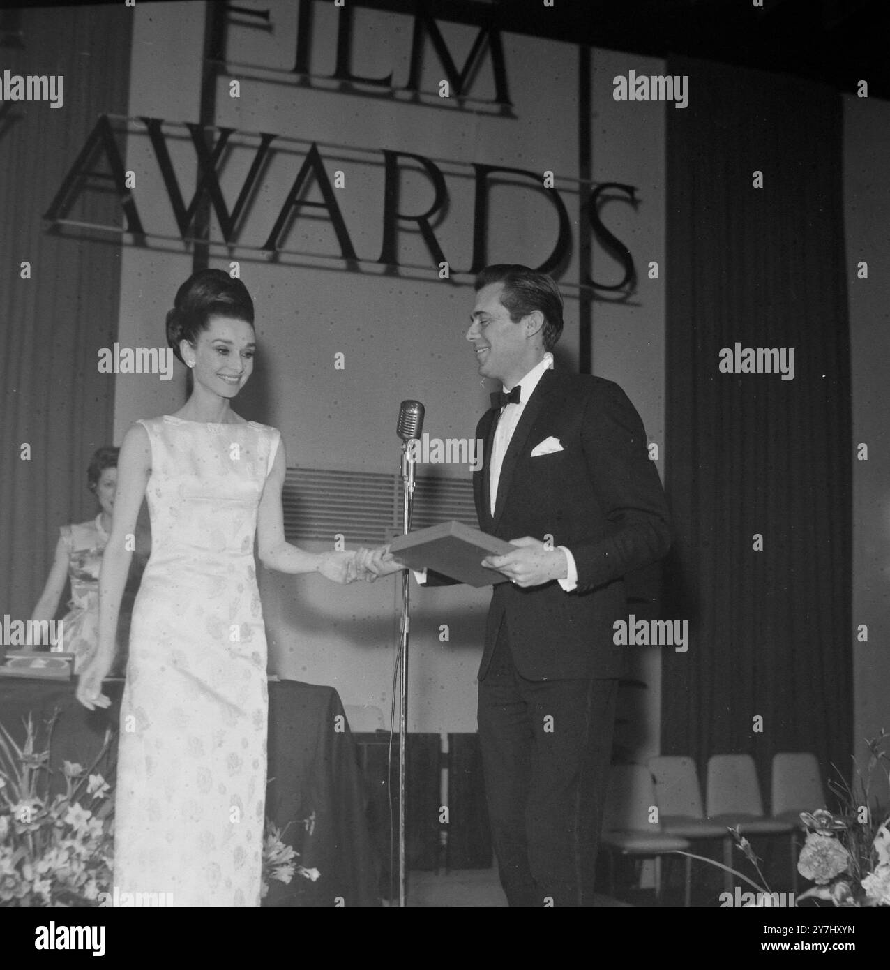 ACTRESS AUDREY HEPBURN PRESENTS DIRK BOGARDE WITH HIS AWARDS AT FILM ...